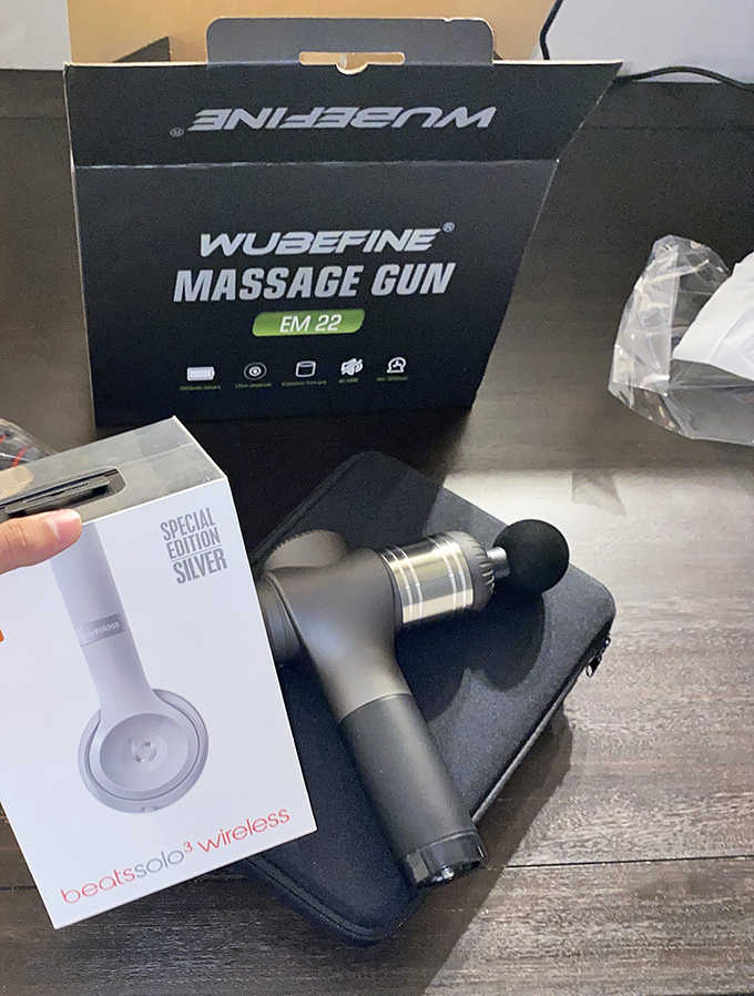 Massage guns and Beats headphones sharing bin space&mdash;like finding a spa day and concert tickets in the same lucky dip.