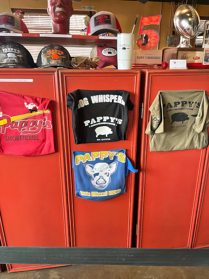 The merch wall: where "Hog Whisperer" t-shirts become must-have souvenirs. Because nothing says "I've been there" like wearing a cartoon pig home.