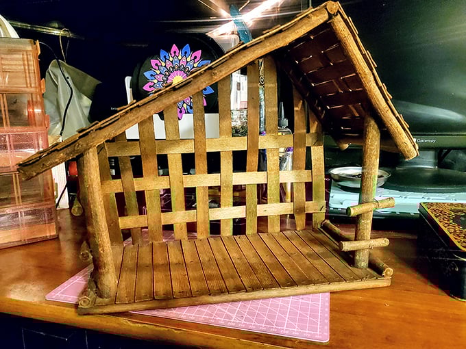 A handcrafted wooden nativity scene waiting for December glory. One person's decluttering becomes another's holiday tradition.