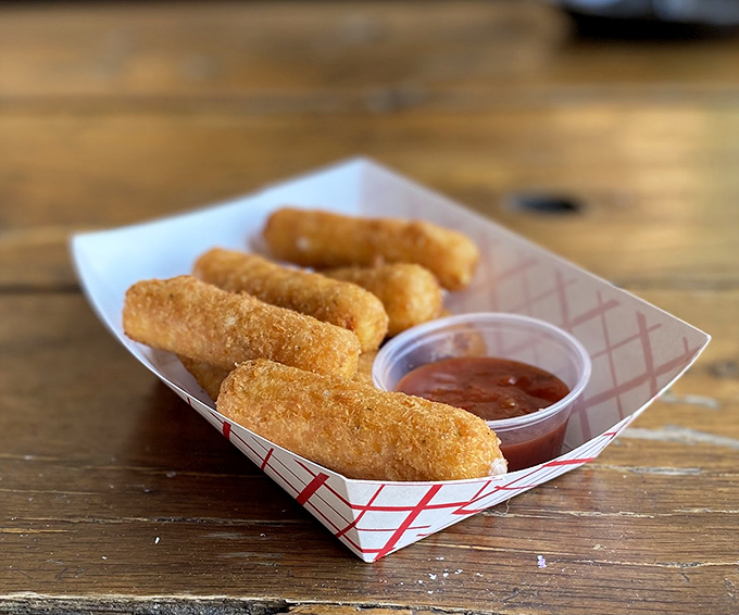 Mozzarella sticks: the finger food that launched a thousand childhood memories, still served in the same red-checkered paper boats.