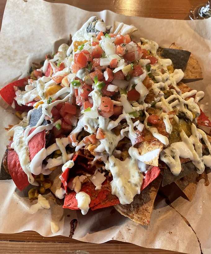 These loaded nachos aren't just a snack&mdash;they're an architectural achievement, with each layer revealing new depths of flavor.