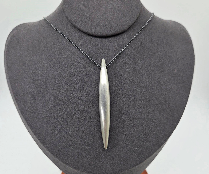Sleek, modern sterling silver pendant proves consignment isn't just about vintage. Contemporary pieces shine just as brightly in their second chapter.