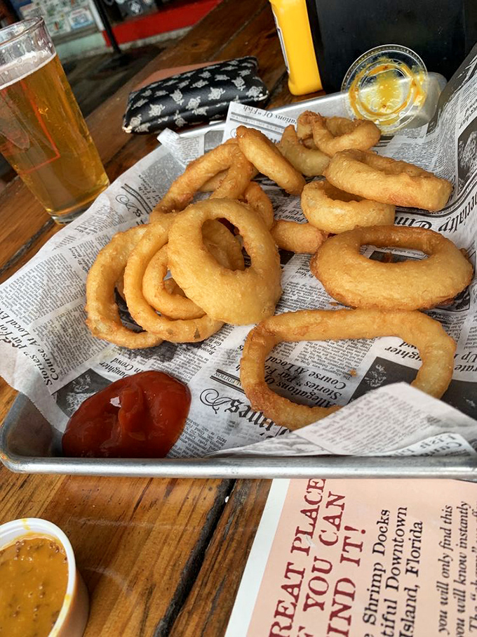 Onion rings should have a crunch that announces itself to the next table. These golden halos make a statement without saying a word.
