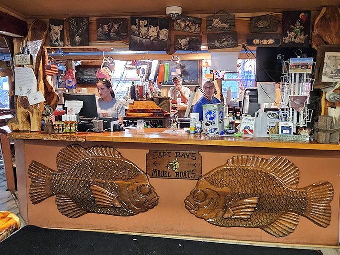 The counter where seafood dreams come true. Those carved wooden fish aren't just decoration&mdash;they're a preview of the ocean's bounty awaiting you.