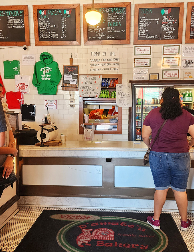 "Home of the Vodka Chicken Parm" proclaims the wall. The counter where dreams come true and diets go to die, gloriously.