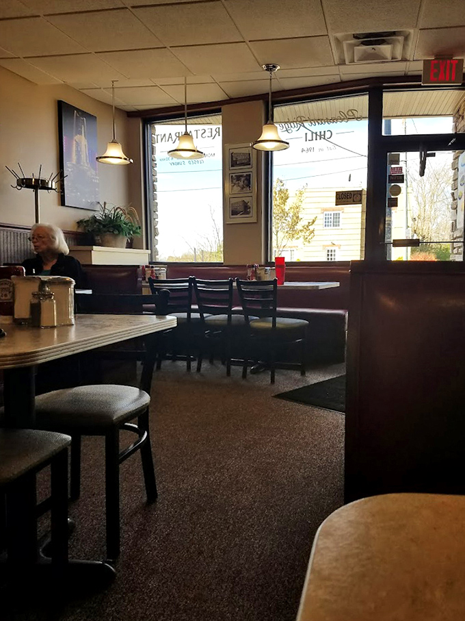 Morning light streams through windows illuminating a quiet corner of this Cincinnati institution. Every booth holds stories of meals past.