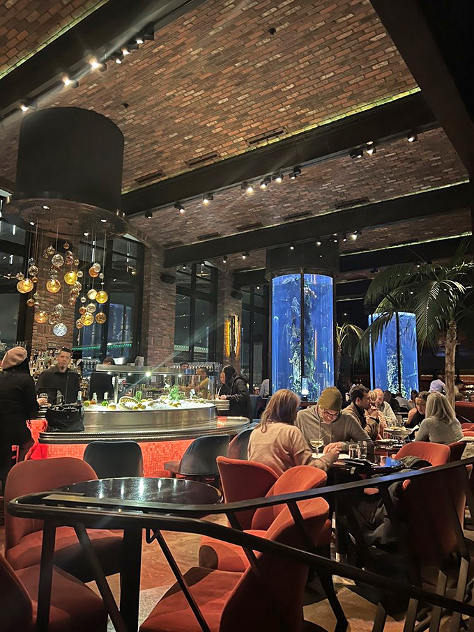 Those cylindrical aquariums aren't just decoration&mdash;they're a reminder that your dinner had neighbors before becoming the catch of the day.