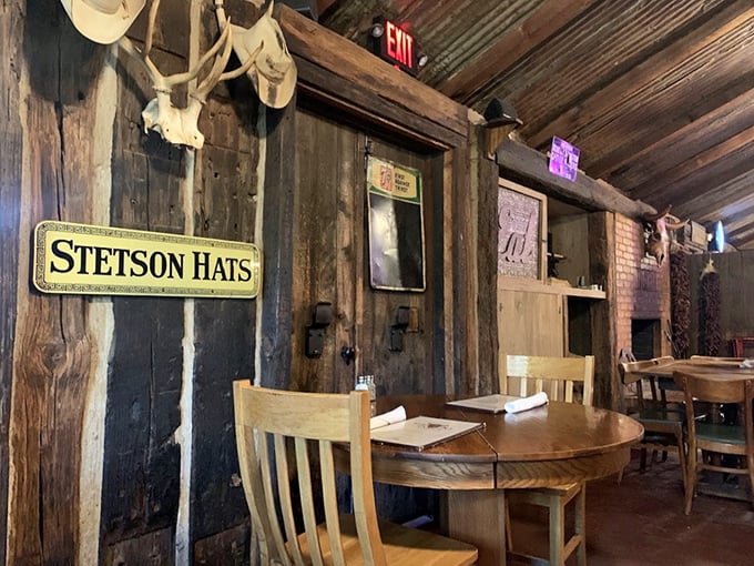 Stetson hats on the wall, wooden everything else. This isn't decorated to look country – it just is country, down to its bones.