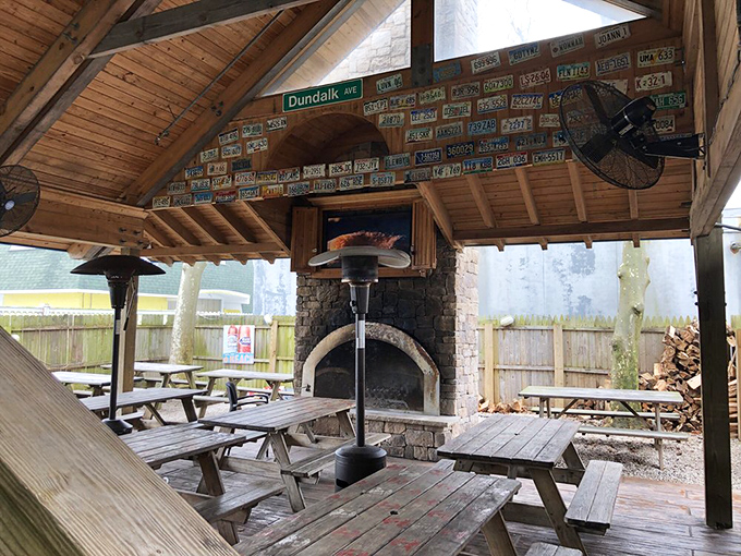 The outdoor patio offers a brief respite between seafood battles. Those license plates on the ceiling tell stories of pilgrims who've made the journey from across America.