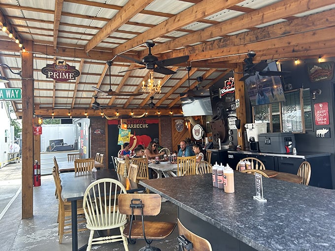 Rustic wooden beams, ceiling fans, and string lights create the perfect setting for what's about to be your new favorite meal.