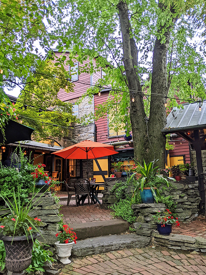 The biergarten's lush greenery and brick pathways create an oasis that makes you forget you're just steps away from small-town Pennsylvania.