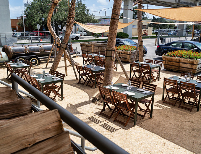 Al fresco dining under palm trees and sail shades &ndash; because barbecue tastes even better with a side of vitamin D.