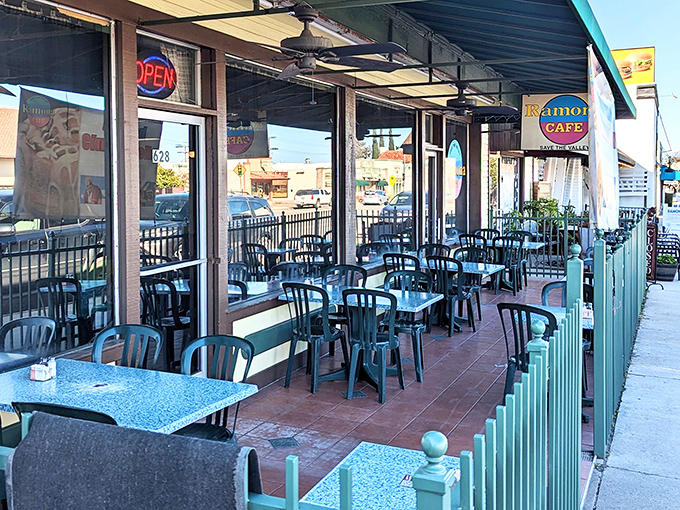 Al fresco dining with a side of people-watching. These turquoise railings have heard more small-town secrets than any therapist.