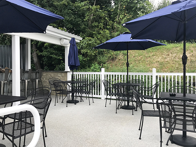 Outdoor dining Pennsylvania-style. Those blue umbrellas aren't just for show &ndash; they're protecting your perfect meal from nature's enthusiasm.