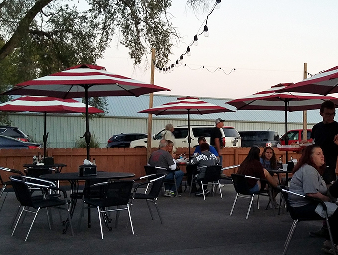 Summer evenings under striped umbrellas, where lake breezes complement every bite and sunset views come complimentary with dinner.