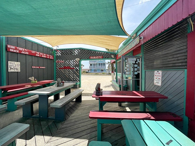 These colorful picnic tables under shade sails offer the perfect casual spot to enjoy your seafood feast while catching the ocean breeze.