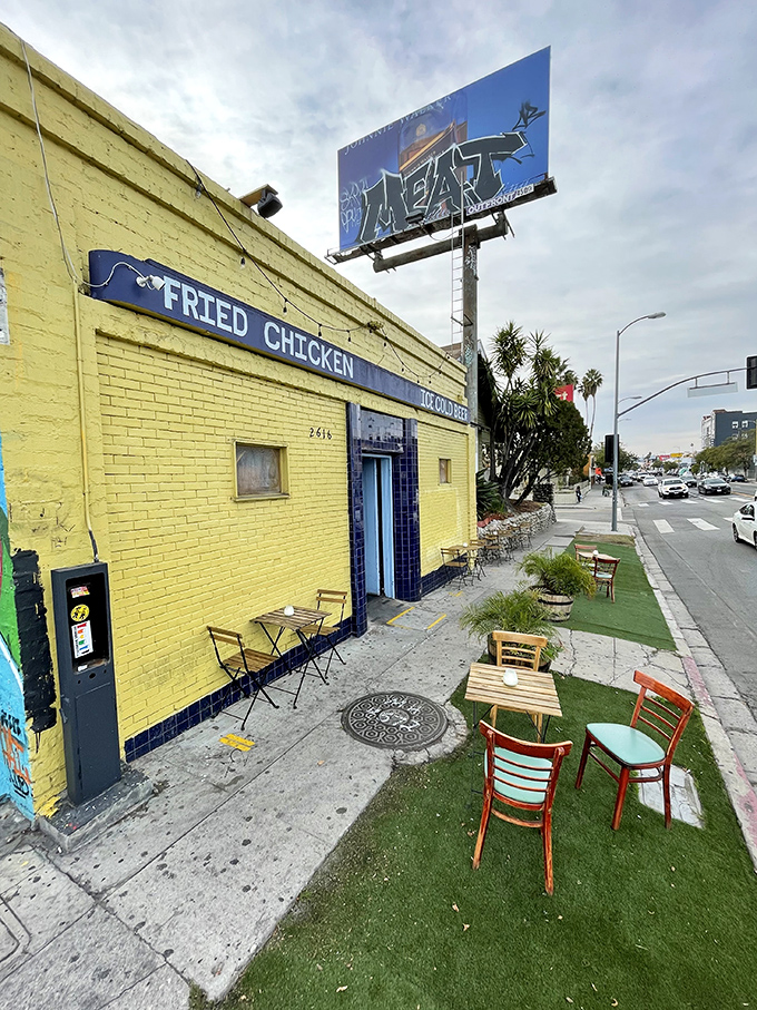 The artificial turf and mismatched chairs outside create an improvised garden party vibe that says, "Come as you are, leave happier."