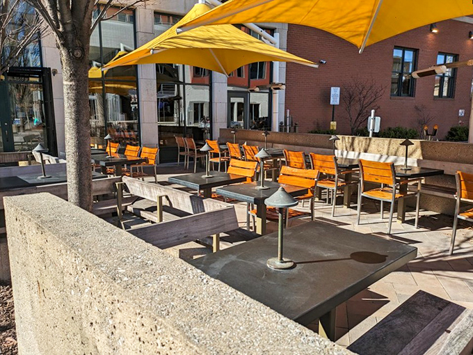 Outdoor dining under those marigold umbrellas feels like you've stumbled into a European café that somehow landed in the Midwest.