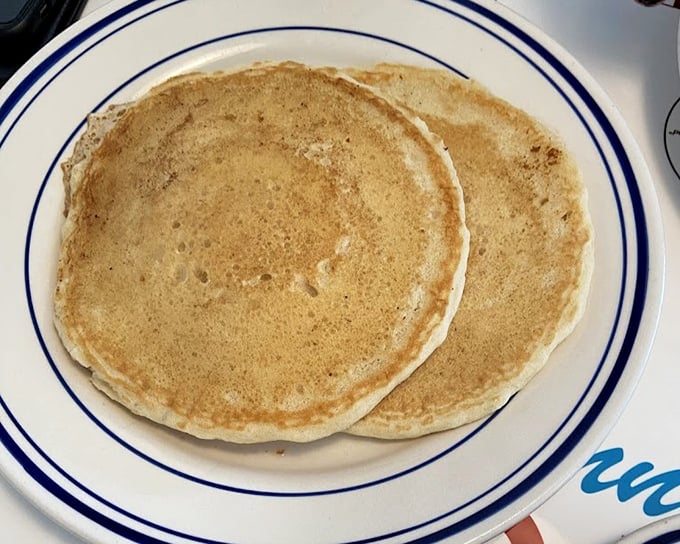 Pancakes that achieve the impossible &ndash; golden outside, cloud-like inside. Two perfect circles of breakfast joy that make you question why you ever make them at home.
