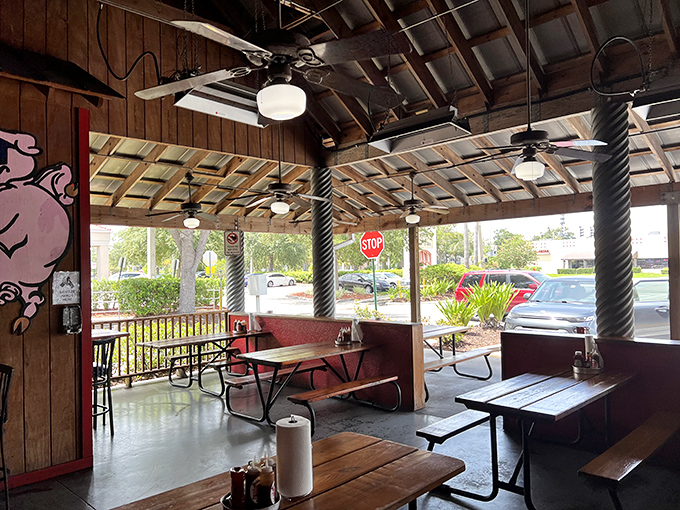 The covered patio offers al fresco dining with a side of people-watching. Even Florida heat surrenders to the pleasure of outdoor BBQ.