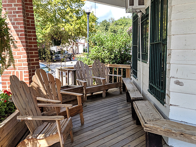The front porch isn't just an entrance&mdash;it's a Southern living room where the rocking chairs practically whisper "sit a spell" as you pass by.