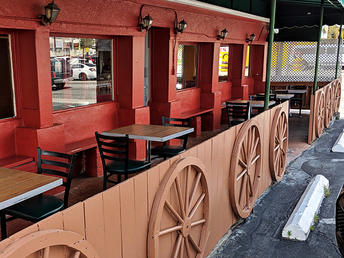 The outdoor patio offers a front-row seat to North Hollywood life, with those signature wagon wheels reminding you this is Texas territory in SoCal.