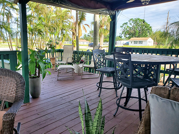 The wraparound porch offers breezy outdoor seating surrounded by lush greenery. Florida dining as it should be&mdash;relaxed and natural.