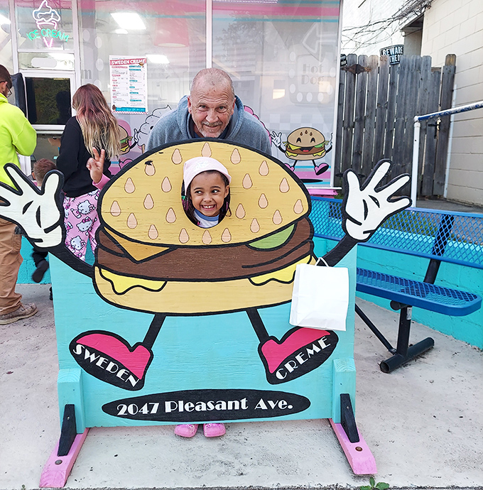 The burger photo cut-out board – where memories are made one silly pose at a time, creating souvenirs sweeter than any dessert.