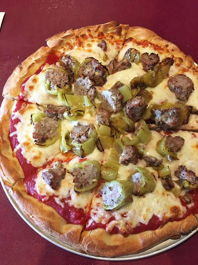 Pizza that proves sausage and green peppers aren't just toppings&mdash;they're supporting actors in the delicious drama unfolding on your plate.
