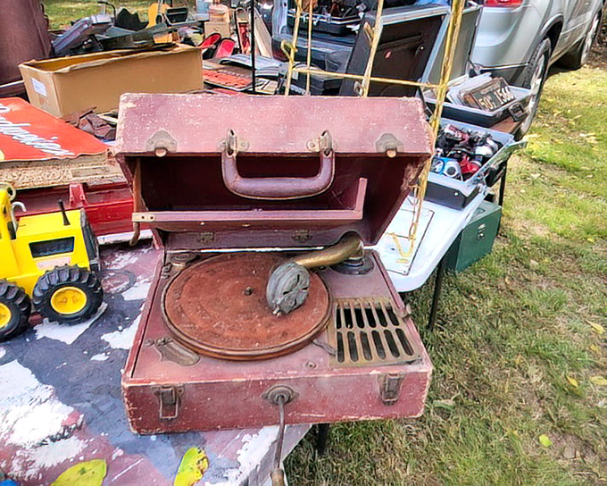 Musical time travel in a suitcase! This vintage portable phonograph once spun the soundtrack to someone's most cherished memories.