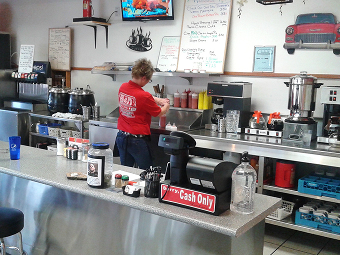 The backstage area where breakfast symphonies are composed. Notice the "Cash Only" sign—a testament to old-school diner traditions.