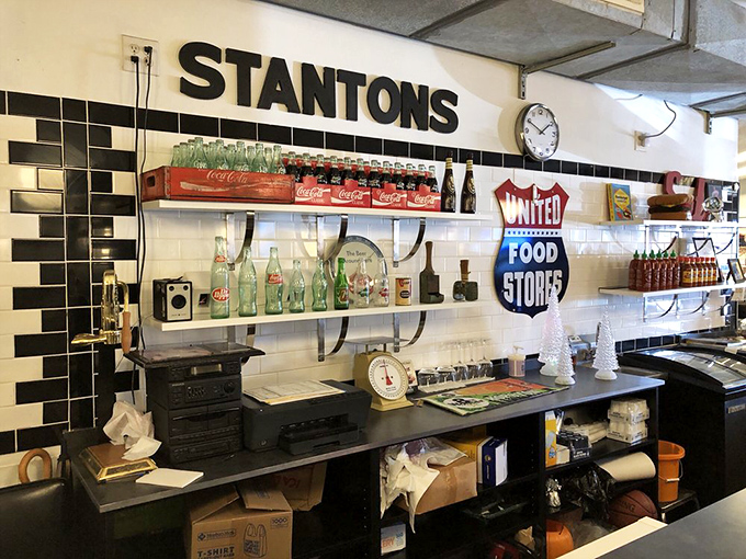 Vintage Coca-Cola memorabilia meets modern-day burger joint. This isn't decoration&mdash;it's a timeline of American comfort food evolution.