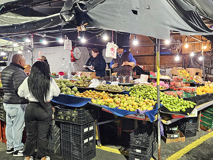 Nature's candy counter under the stars. These twilight fruit vendors offer the freshest ingredients for tomorrow's breakfast smoothie.
