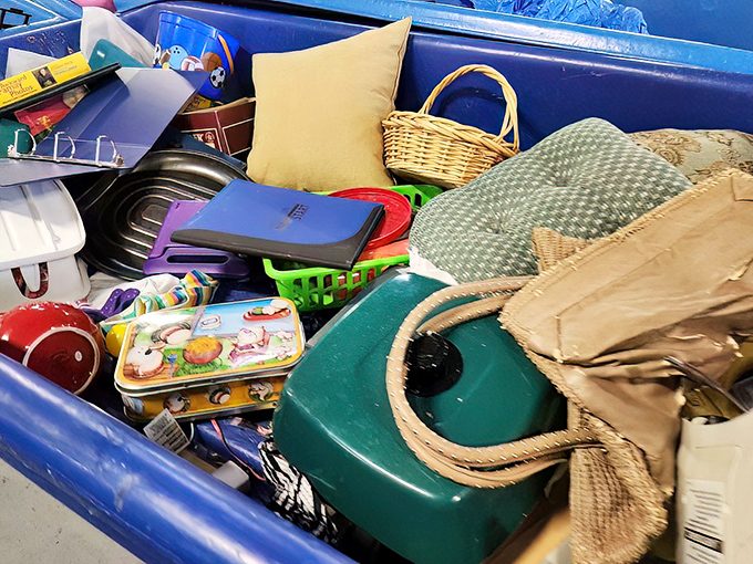 A blue bin brimming with household potential. That wicker basket could hold fruit in someone's kitchen by tomorrow afternoon.