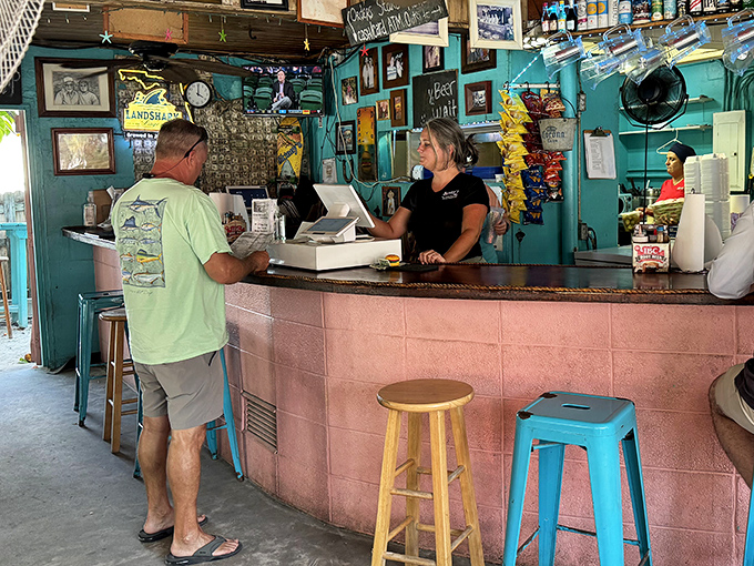 The pink counter where transactions are made, but the real currency is the smile that comes with your burger.