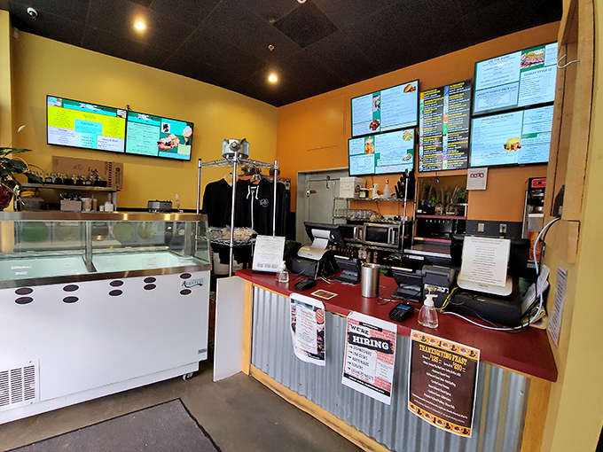 Where barbecue dreams begin their journey from kitchen to table. The menu board promises smoky delights ahead.