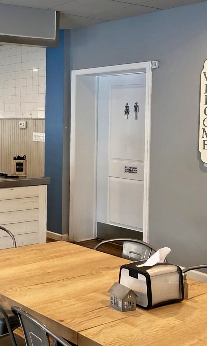 Even the restroom sign maintains the clean, minimalist aesthetic that lets you know this place focuses on what matters &ndash; the food.