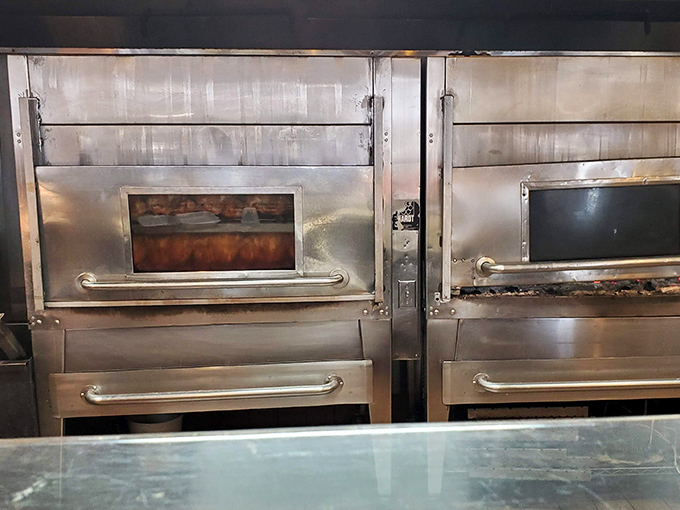 Behind the glass: where chicken magic happens. These rotisserie ovens have seen things, delicious things that would make a foodie weep with joy.