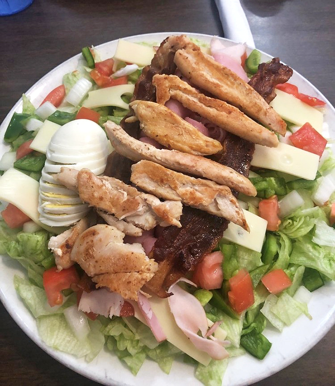 A chef's salad that doesn't apologize for its abundance. When vegetables are merely the opening act for protein's main performance.