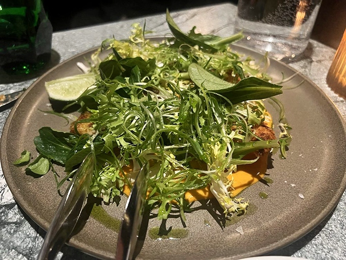 A salad so fresh and vibrant it practically photosynthesizes on the plate. Those greens aren't just healthy&mdash;they're an essential counterpoint to seafood indulgence.