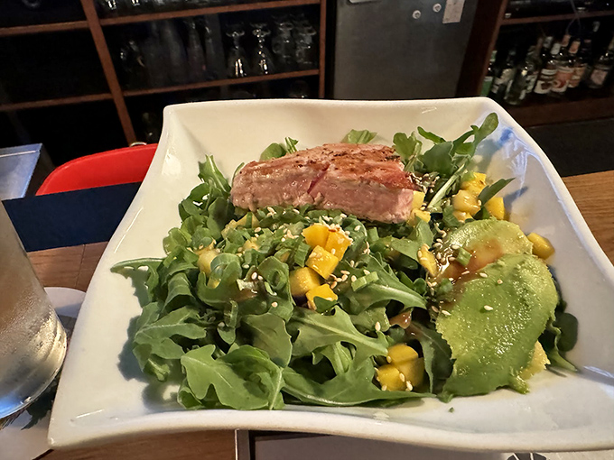This isn't just a salad&mdash;it's a colorful canvas where greens, mango, and perfectly cooked protein come together in a masterpiece of healthy indulgence.