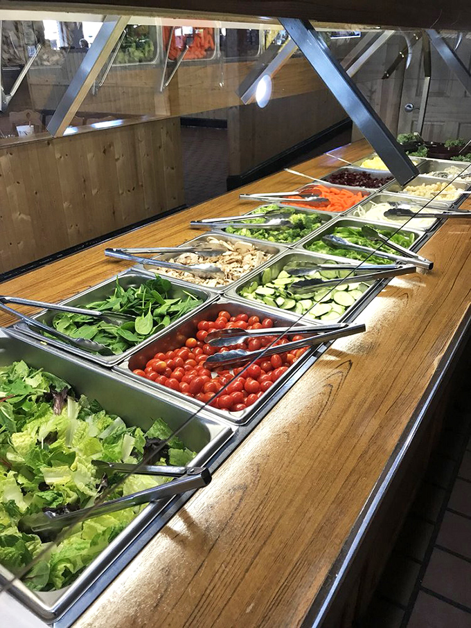 A salad bar that doesn't feel like punishment. Fresh ingredients waiting to balance out all that glorious seafood you're about to devour.