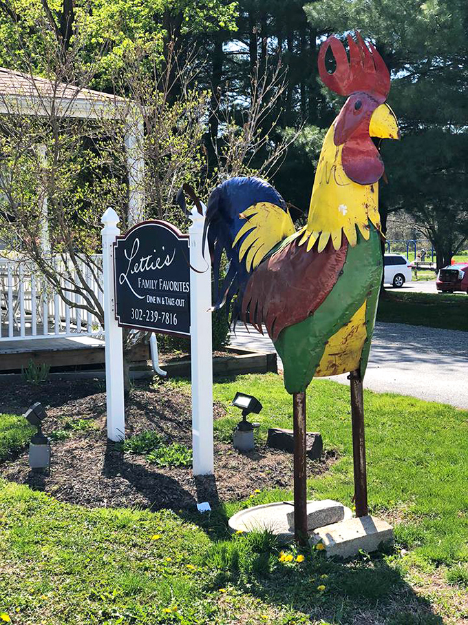 Not just any rooster statue&mdash;this colorful sentinel stands guard outside Lettie's, a whimsical herald announcing "serious chicken territory ahead."