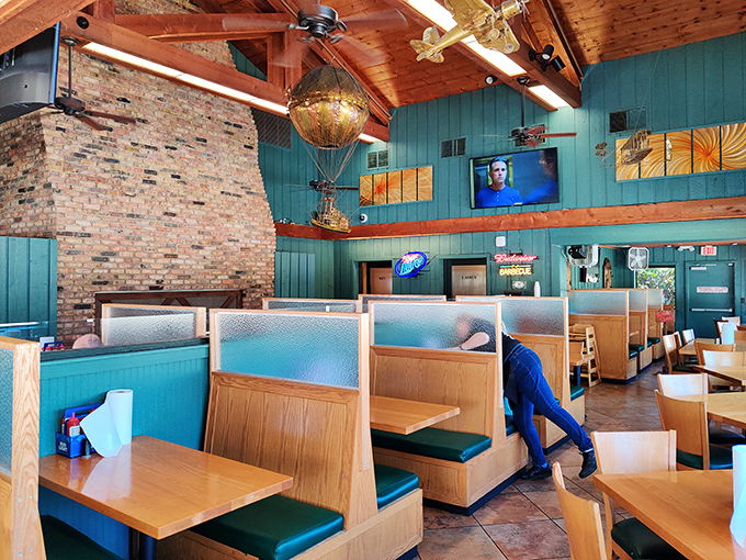 Booths designed for lingering conversations and serious eating, under wooden beams that have witnessed countless barbecue epiphanies.