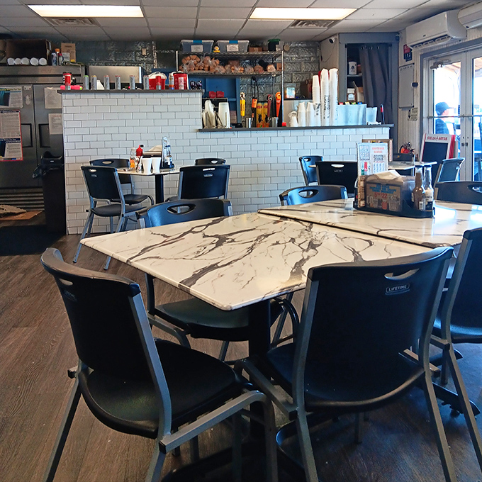 Simple tables, practical chairs, and food that makes you forget you're sitting on plastic. That's the mark of a true local gem. 