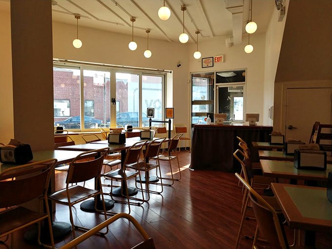 Morning light streams through windows in this tranquil dining space. Empty now, but soon to be filled with the happy murmurs of satisfied diners.