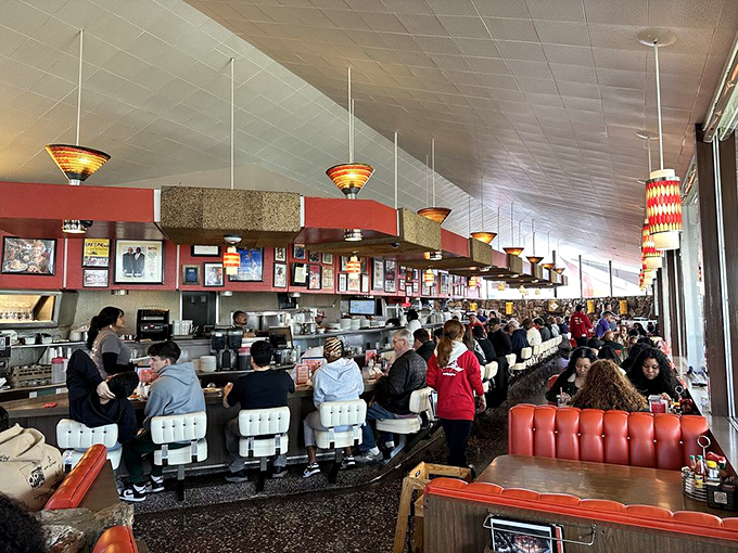 The counter seating offers front-row tickets to the greatest show in town: short-order cooks performing culinary choreography with practiced precision.