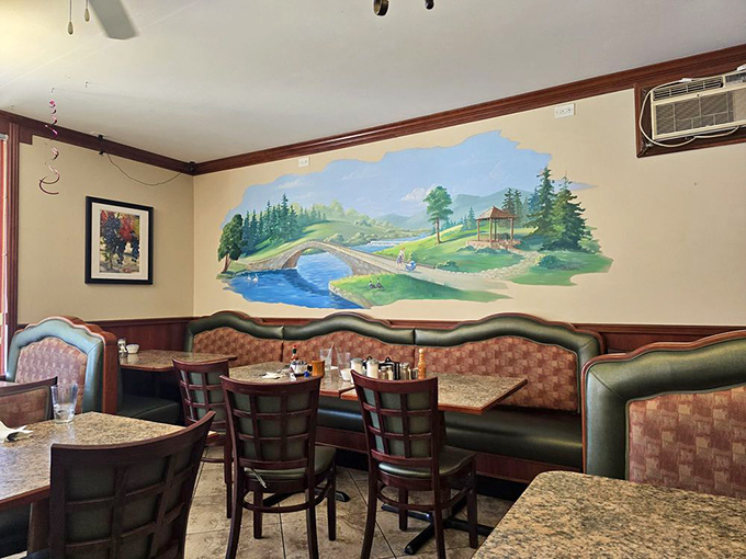 The mural says "relax and stay awhile" while those booths whisper "slide in and tell me your troubles" in the universal language of comfort.