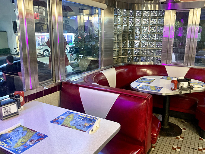 Corner booths: the VIP section of diner real estate. Red and cream vinyl thrones where breakfast dreams come to life.