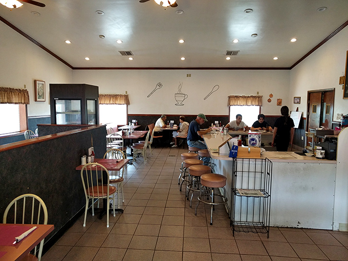 Cozy booth seating where locals gather to share stories and visitors discover what real hospitality means.